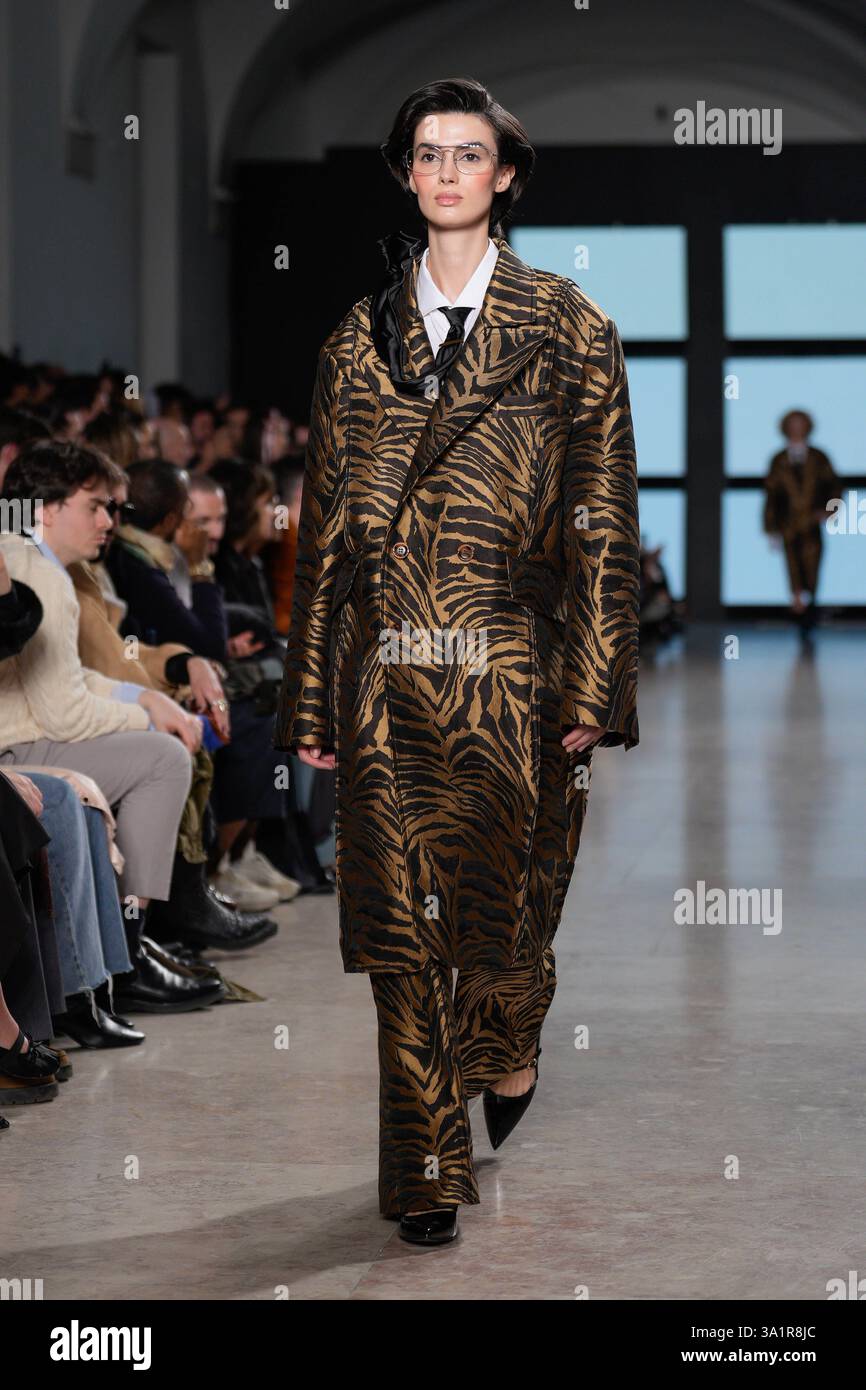 A model walks the runway during Luis Carvalho fashion show at ...