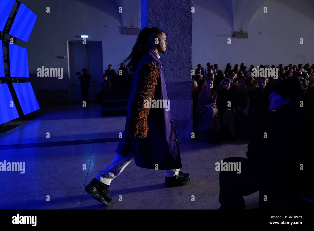 Lisbon, Portugal. 08th Mar, 2025. A model walks the runway during ...