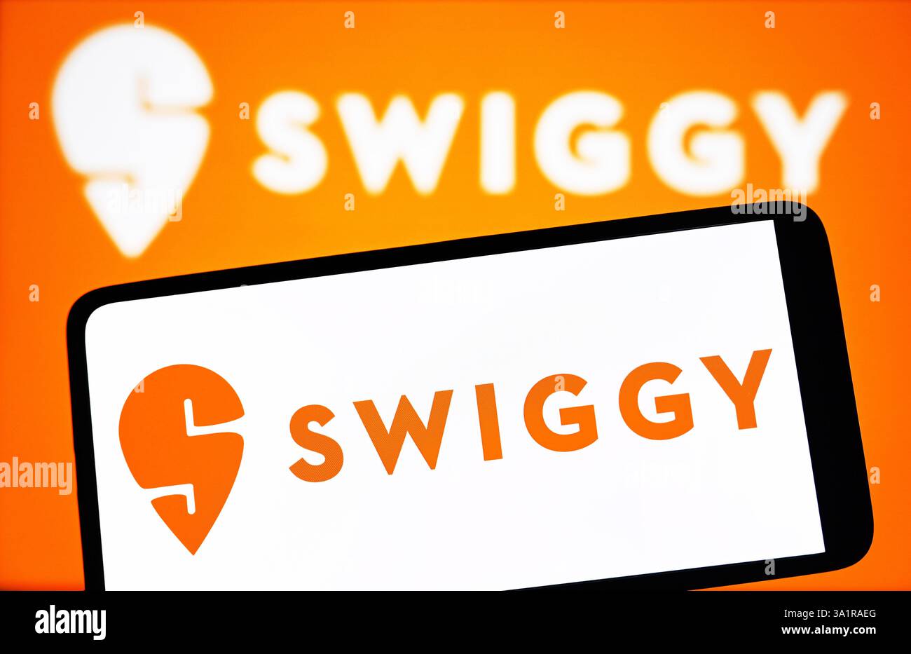 In this photo illustration, a Swiggy logo is seen on a smartphone and ...