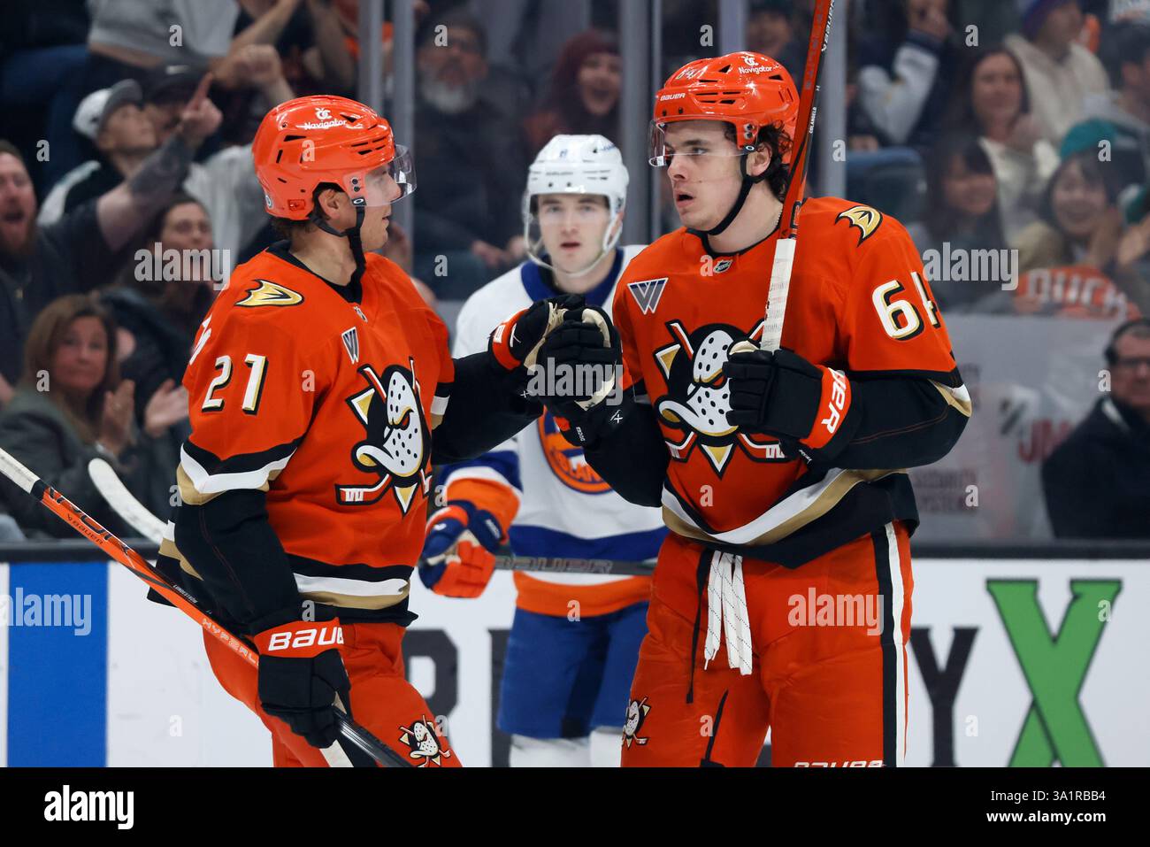 Anaheim Ducks winger Sam Colangelo, right, celebrates with center Isac ...