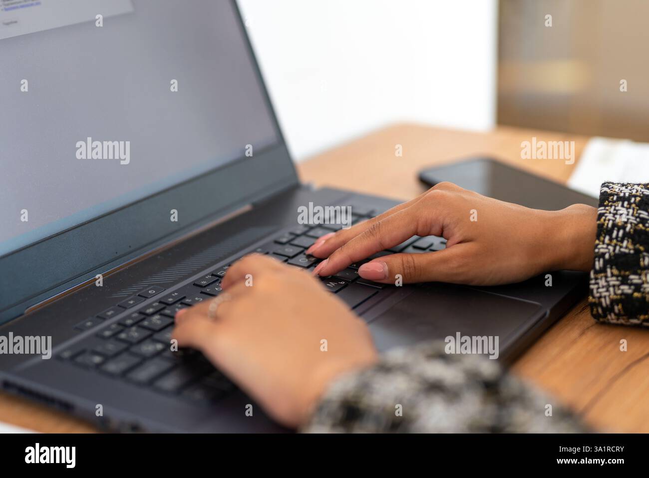 Female hands working on laptop keyboard in office. fingers type at keys ...