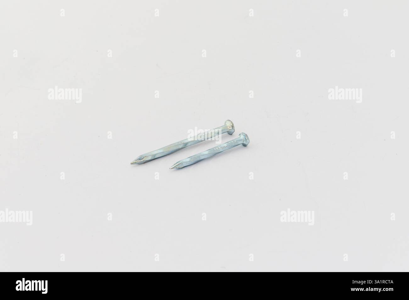 Two Different Sizes Galvanized Steel Nails on a White Background Stock ...