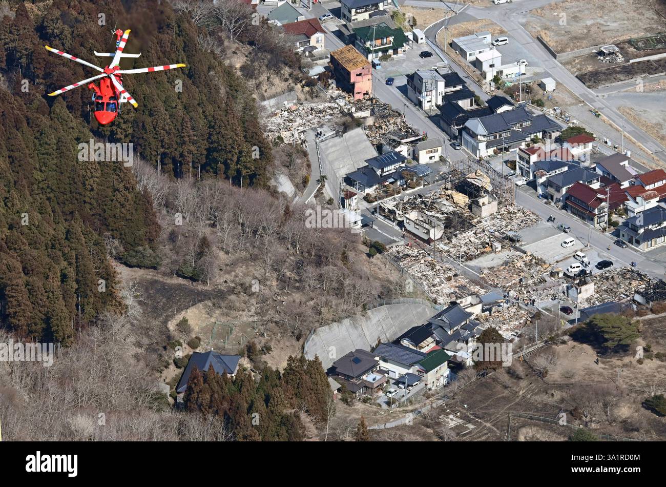 Aerial photograph shows houses damaged by forest fires in Ofunato ...