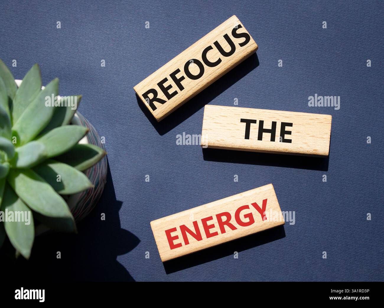 Refocus the Energy symbol. Concept word Refocus the Energy on wooden ...