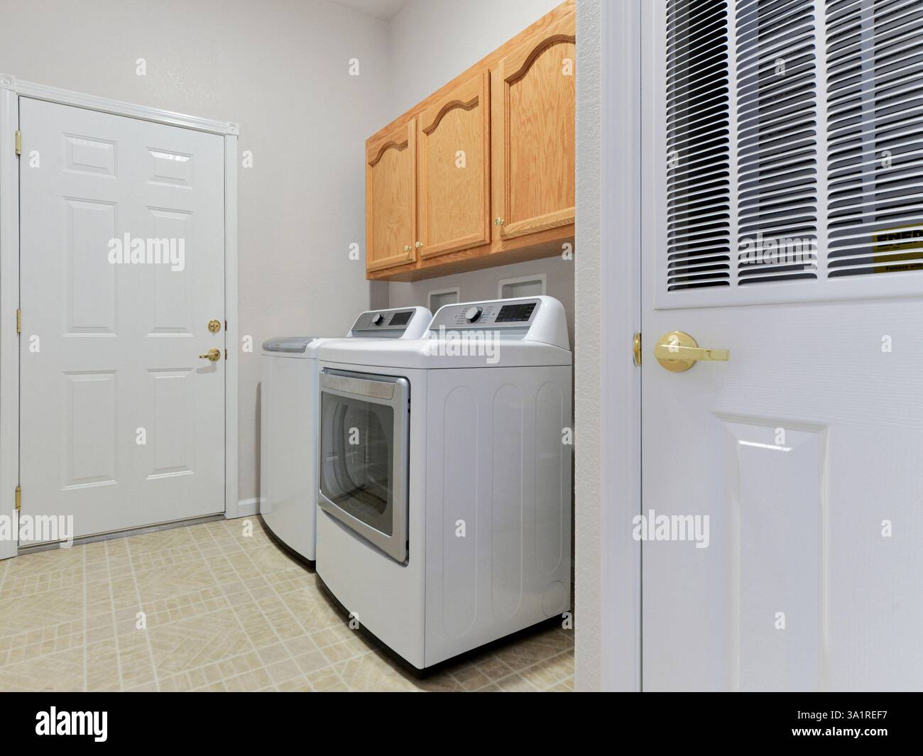 Modern residential laundry room interior Stock Photo - Alamy