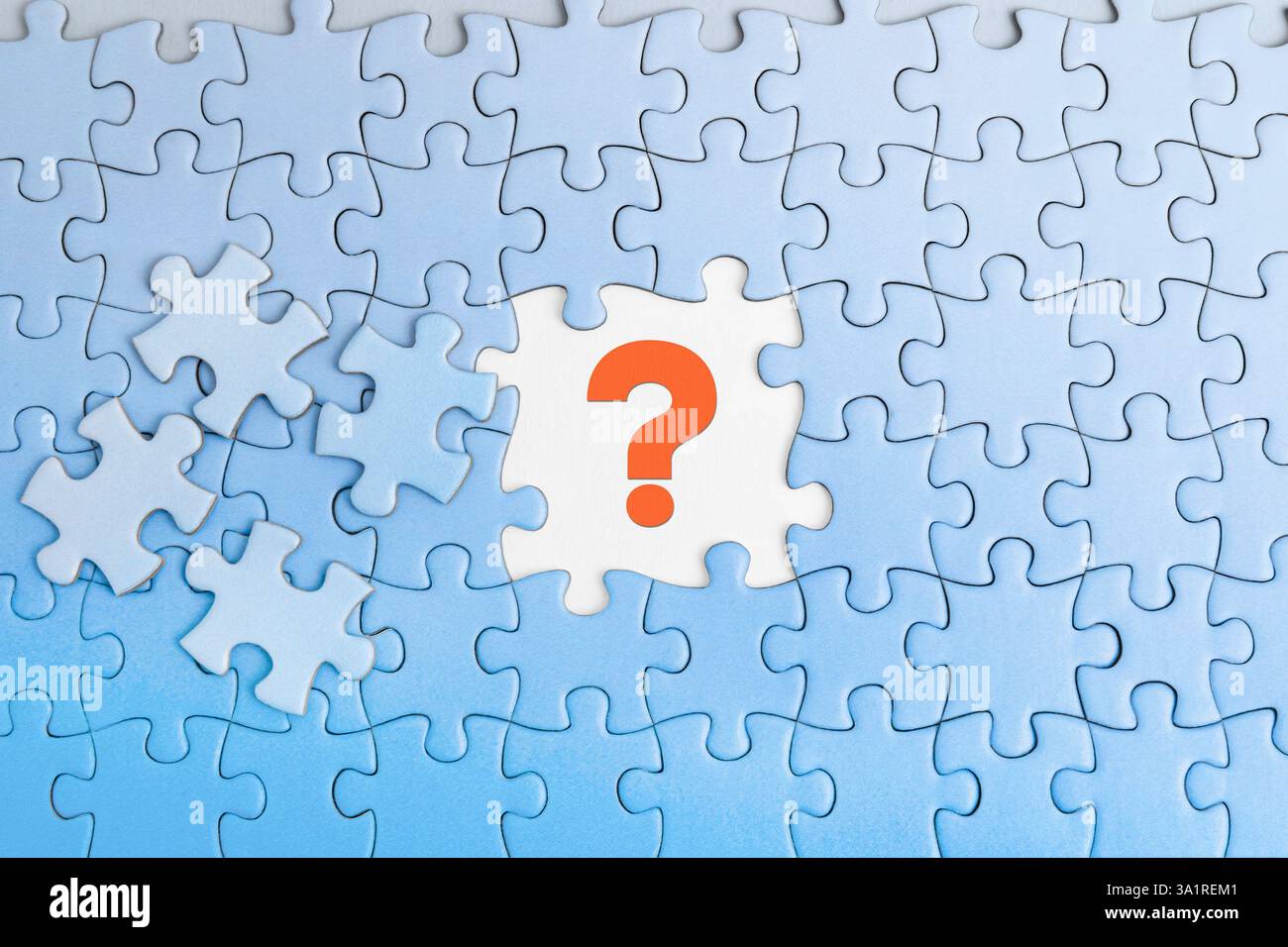 A blue background displays puzzle pieces, with a red question mark ...