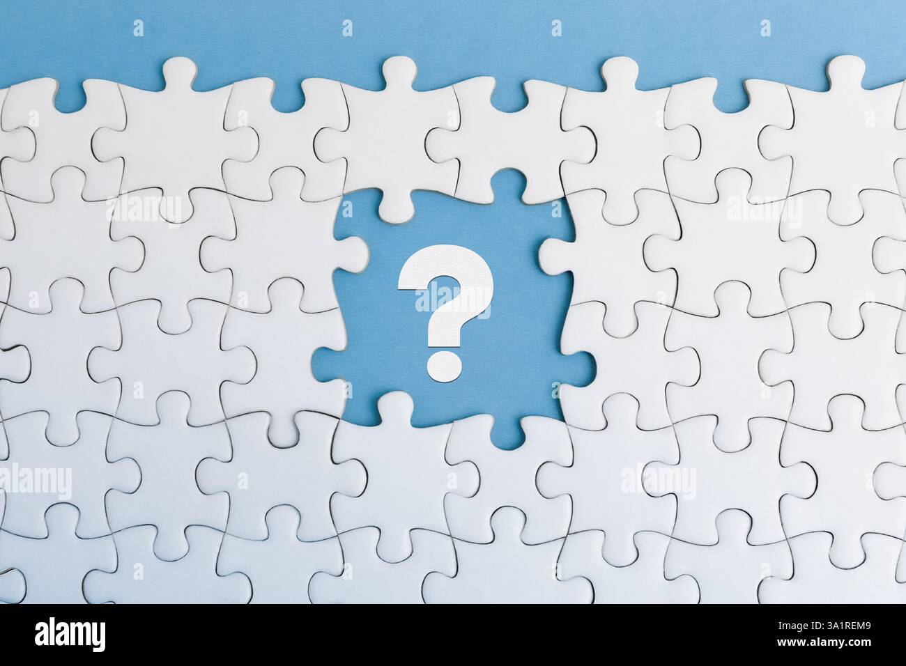 An incomplete jigsaw puzzle with a distinct absence of a white question ...