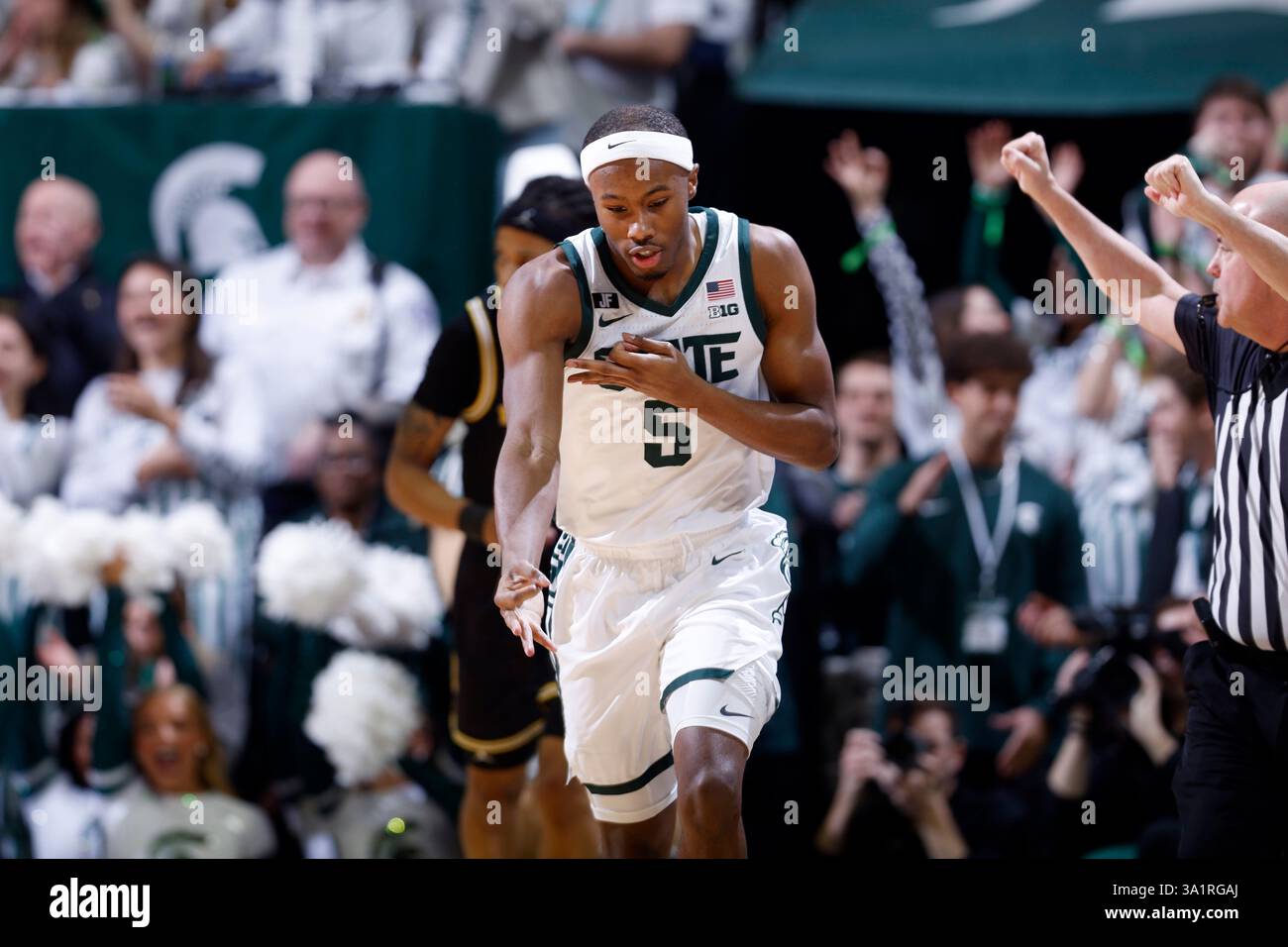 Michigan State guard Tre Holloman (5) reacts during an NCAA college ...