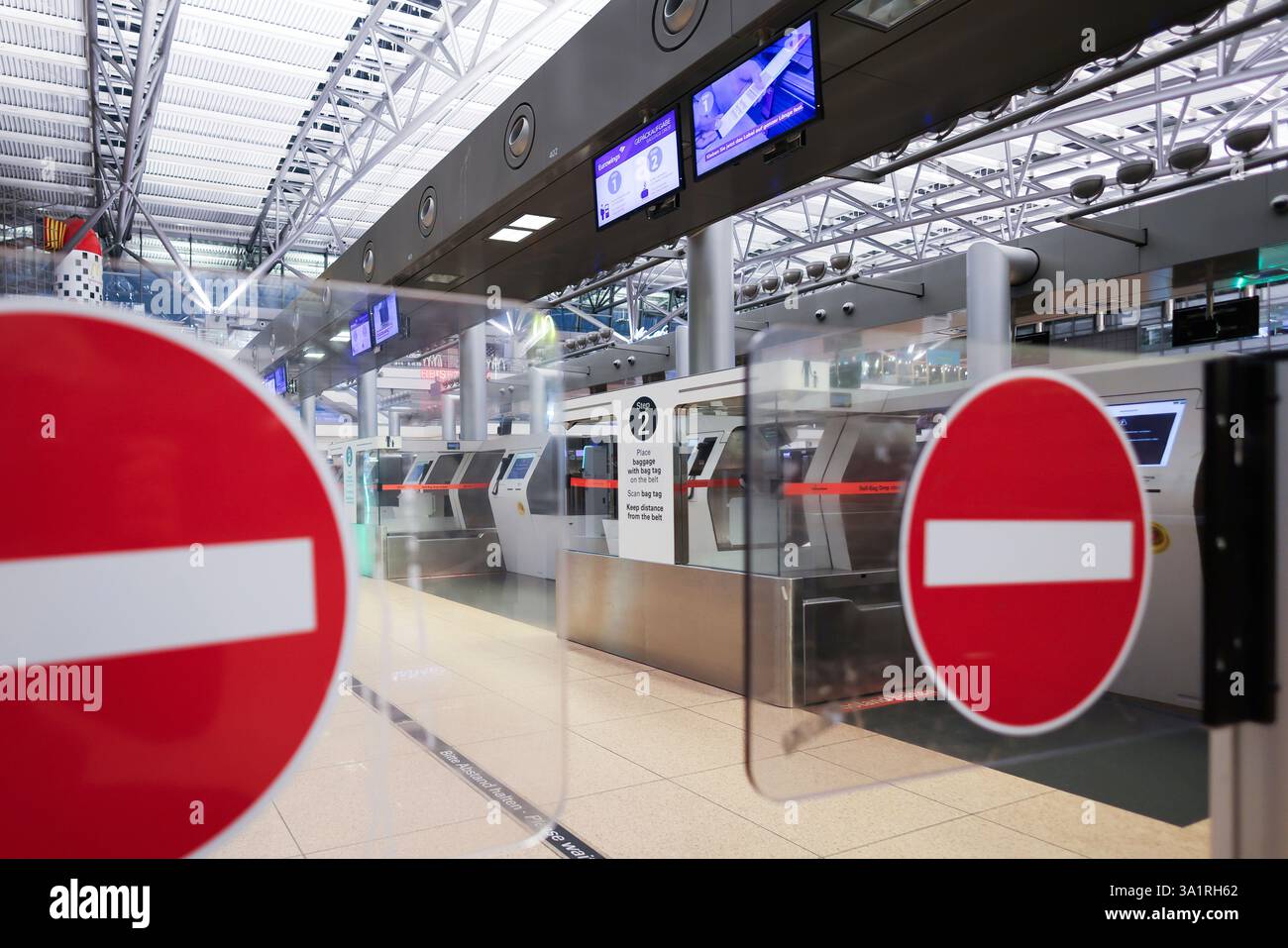 The signs ""Passage prohibited"" can be seen at a check-in counter in ...