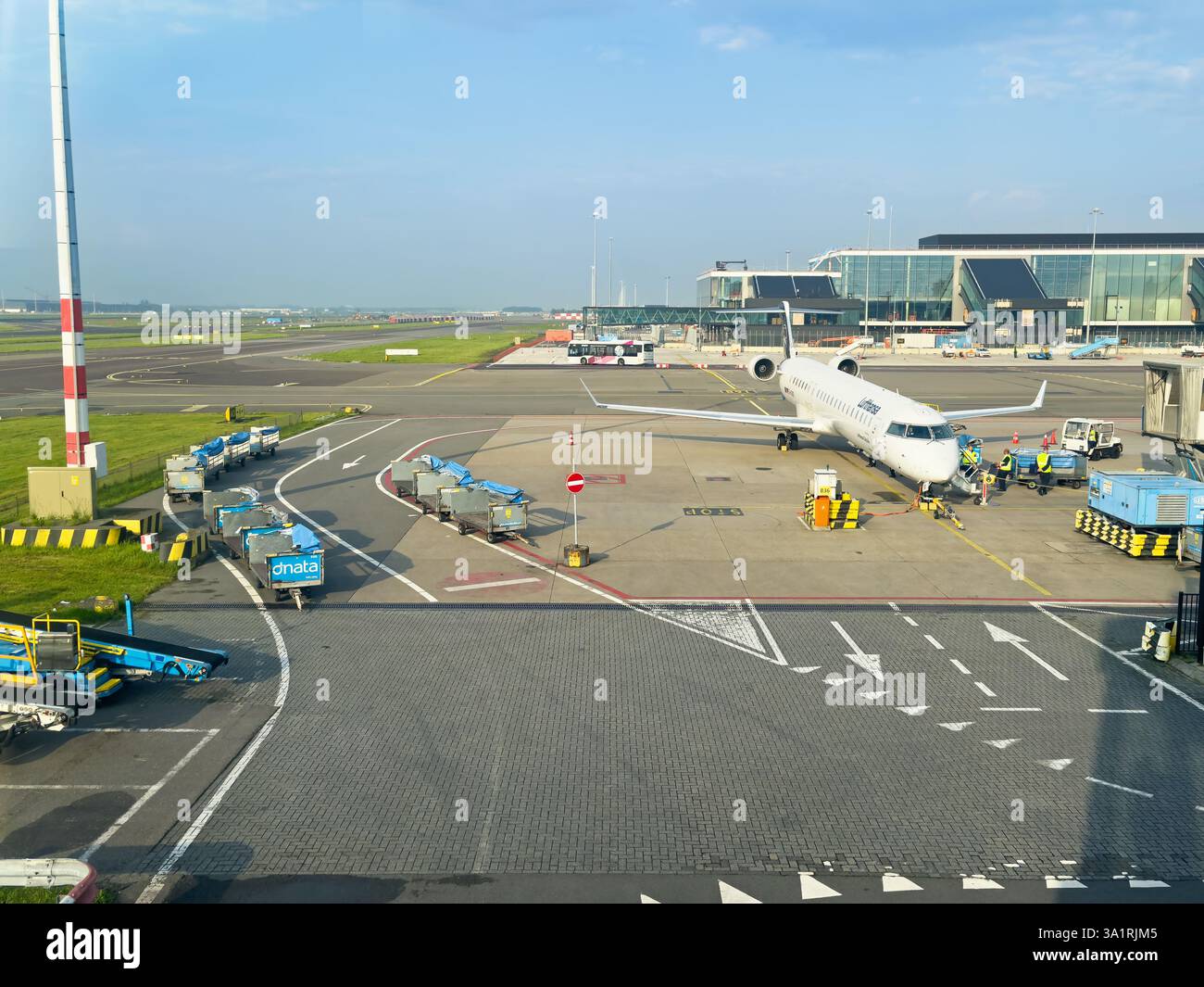 Airfield with airliner and the landing field Stock Photo - Alamy