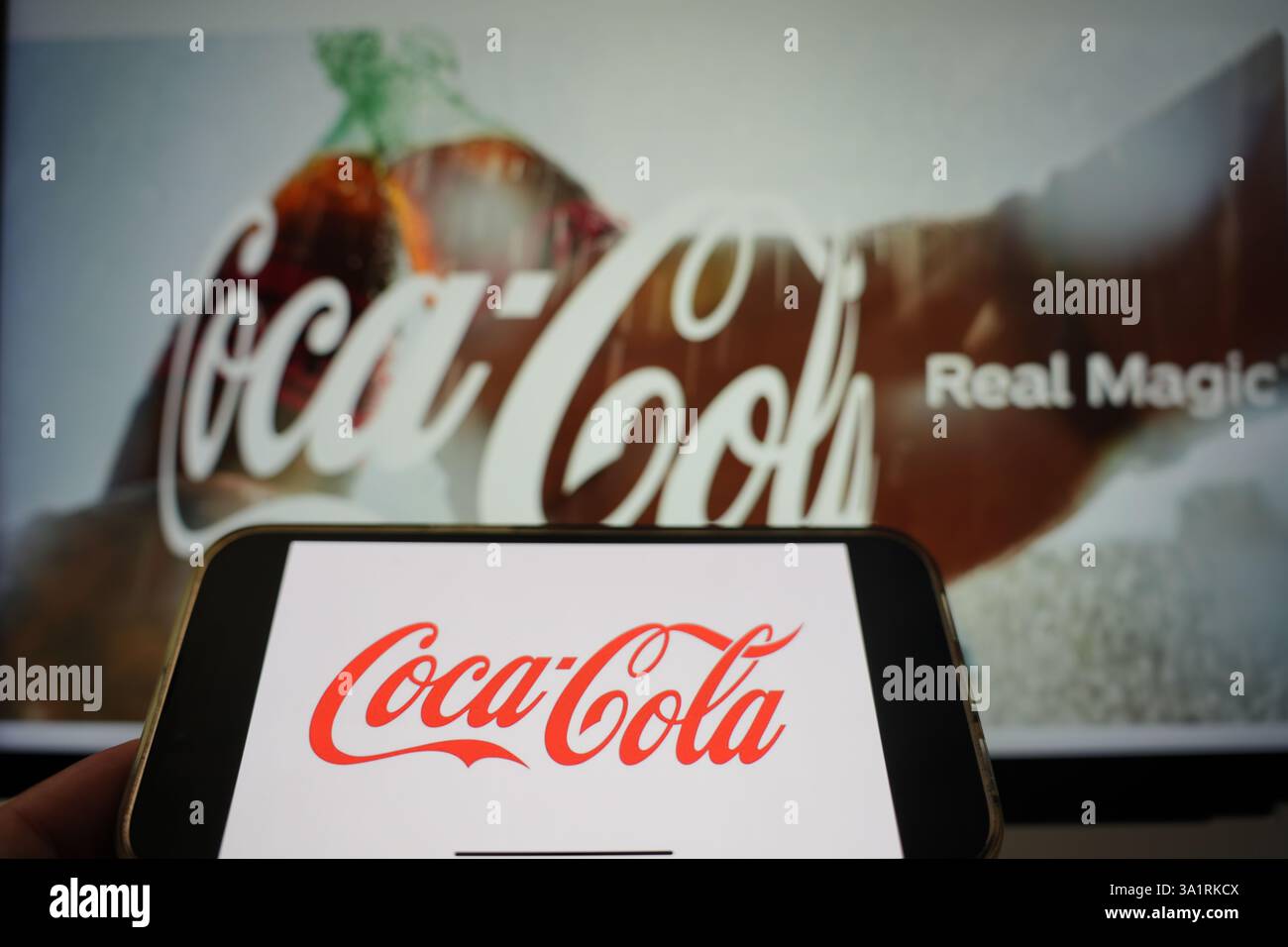 Roosendaal, The Netherlands - March 10, 2025: A mobile phone displaying the logo of Coca-Cola ...