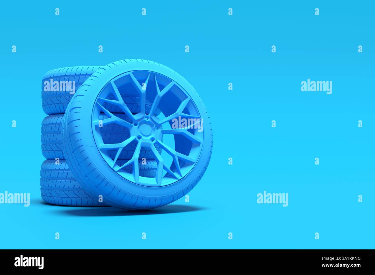 Stack of blue automobile wheels with alloy rims on a blue background ...