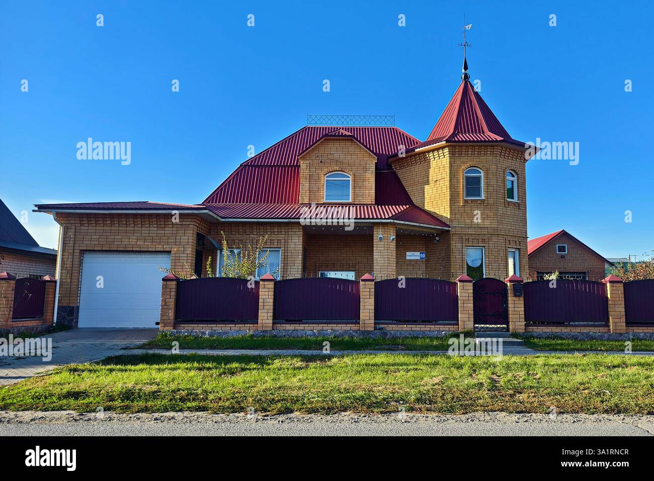 Brick house in suburbs with car garage. private house in Russian style ...