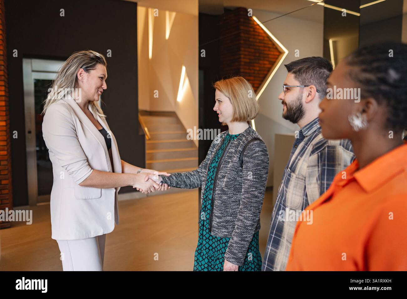Group of People Standing Around Each Other Shaking Hands Stock Photo ...