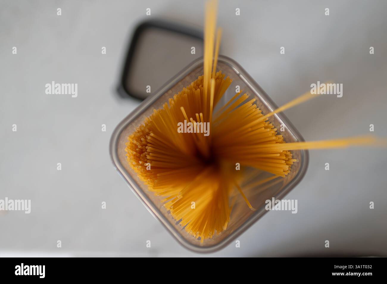 Spaghetti raw, long pasta in box, top view grey background, with space ...