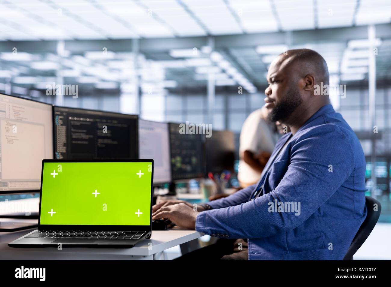 Server Room Programmer Using Green Screen Laptop To Find Firewall