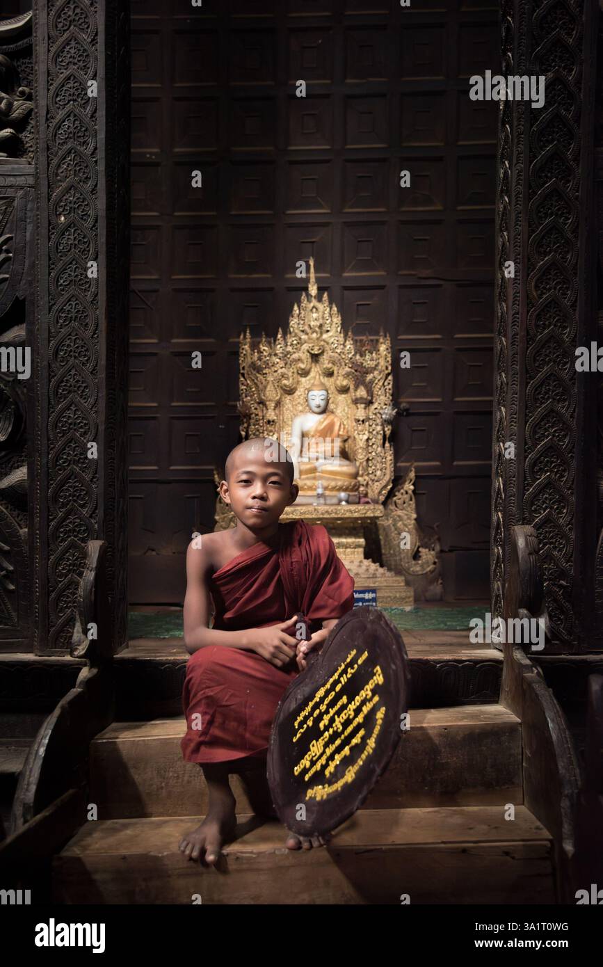 Novice monk at the historic Bagaya Monastery, also known as Bagaya ...