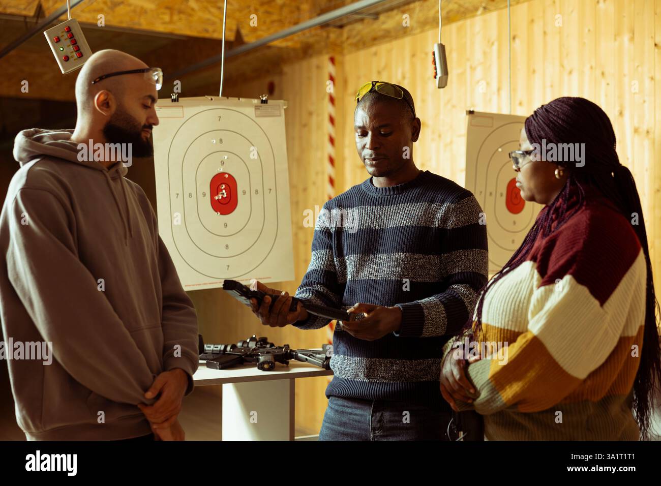Shooting range safety officer demonstrating how to safely reload ...