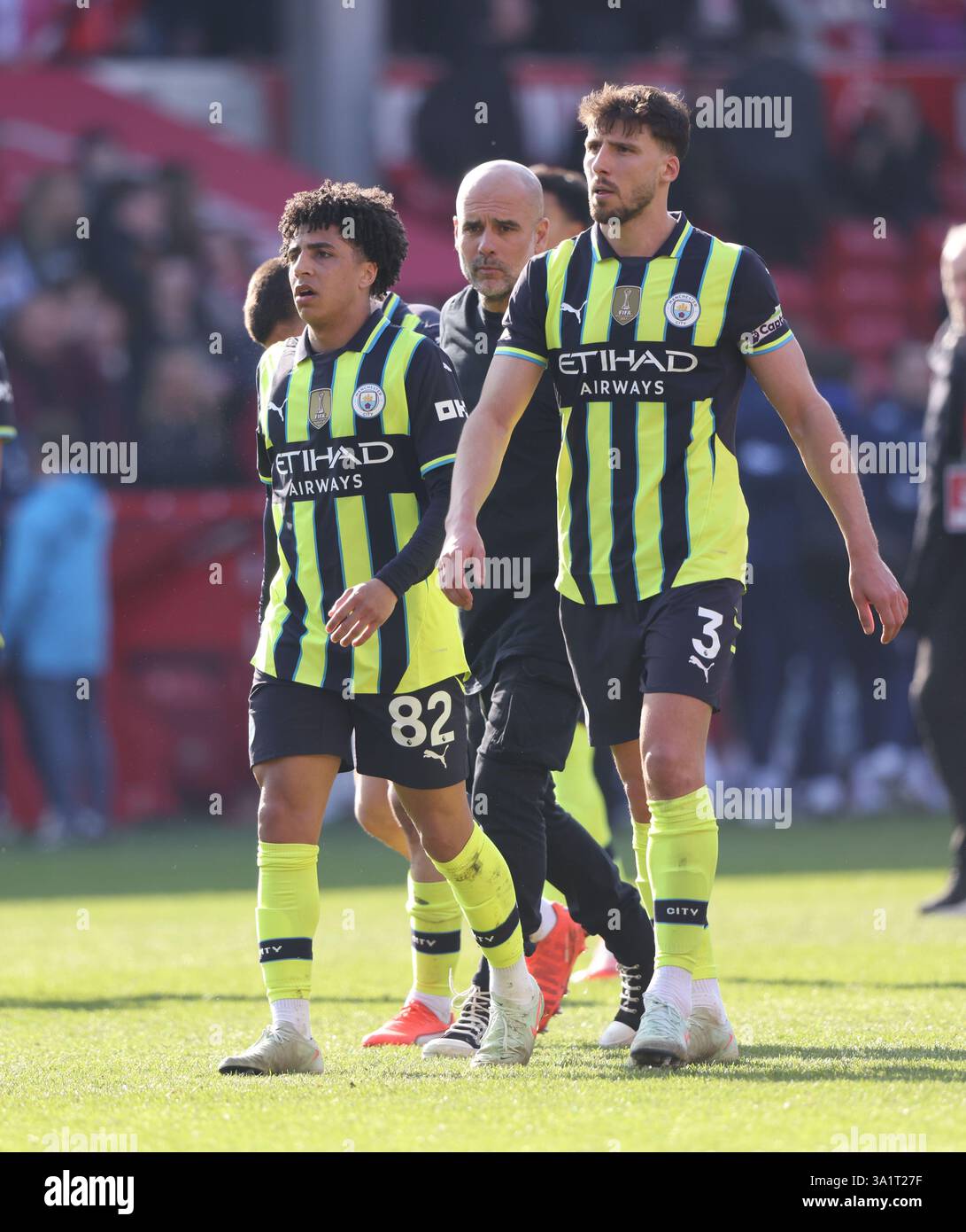 Nottingham, UK. 08th Mar, 2025. Rico Lewis (MC) Pep Guardiola (Man City ...