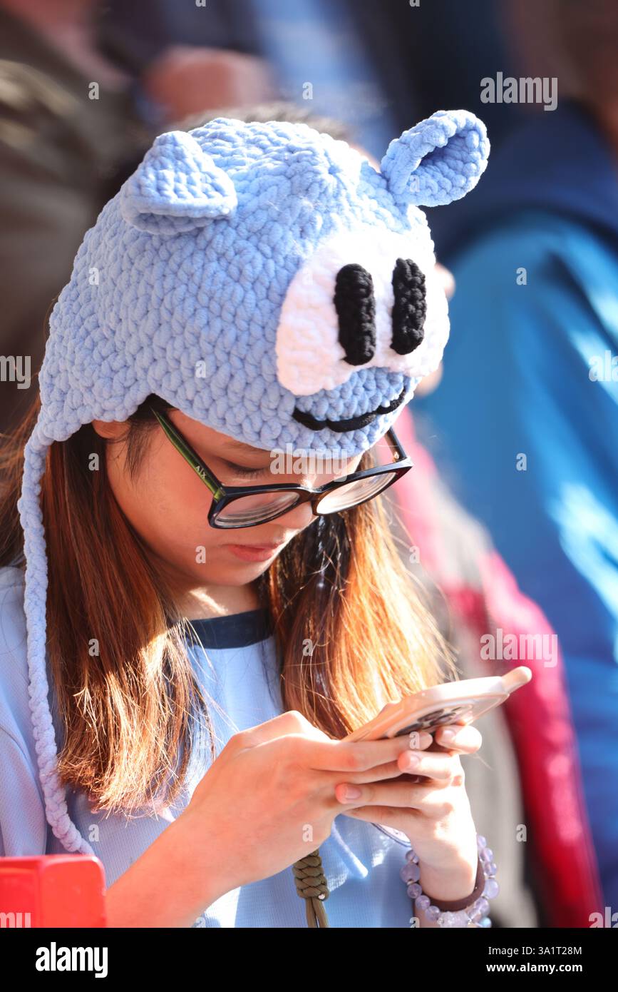Nottingham, UK. 08th Mar, 2025. Man City fan checks their phone at the ...