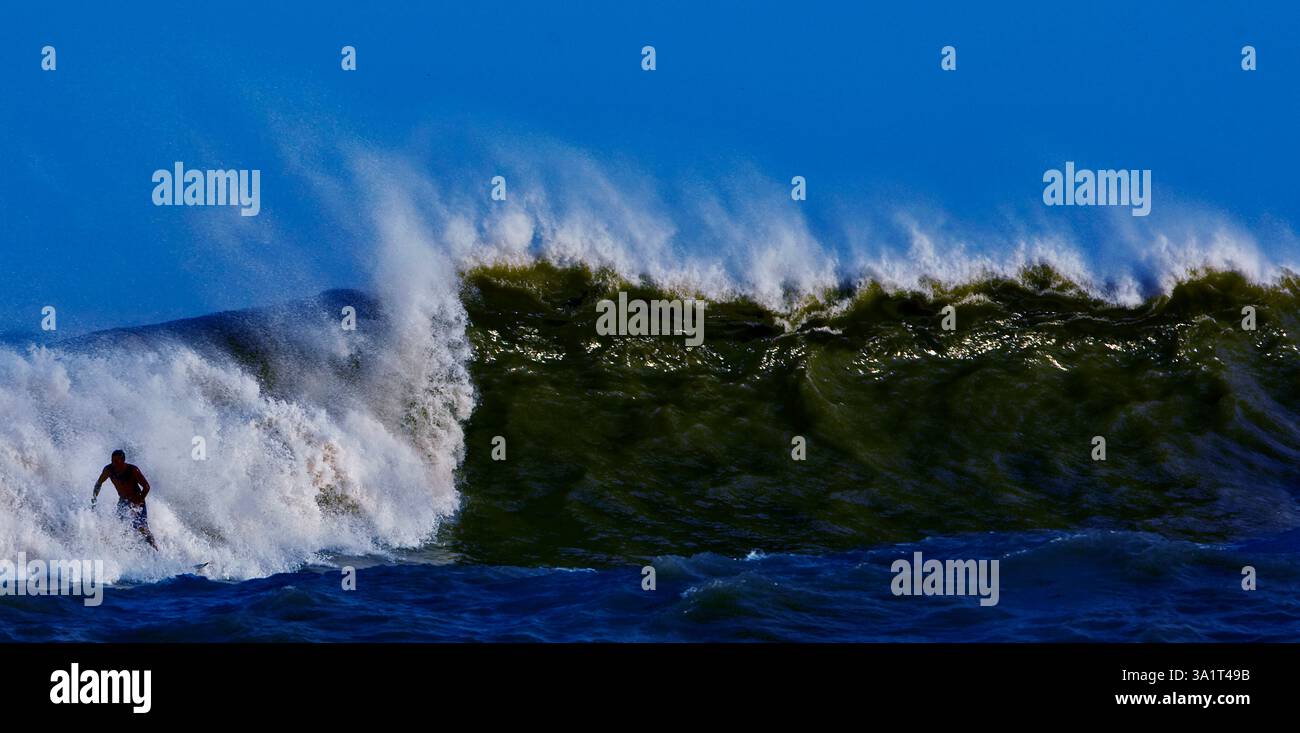 Surfing storm waves in South Texas Stock Photo - Alamy