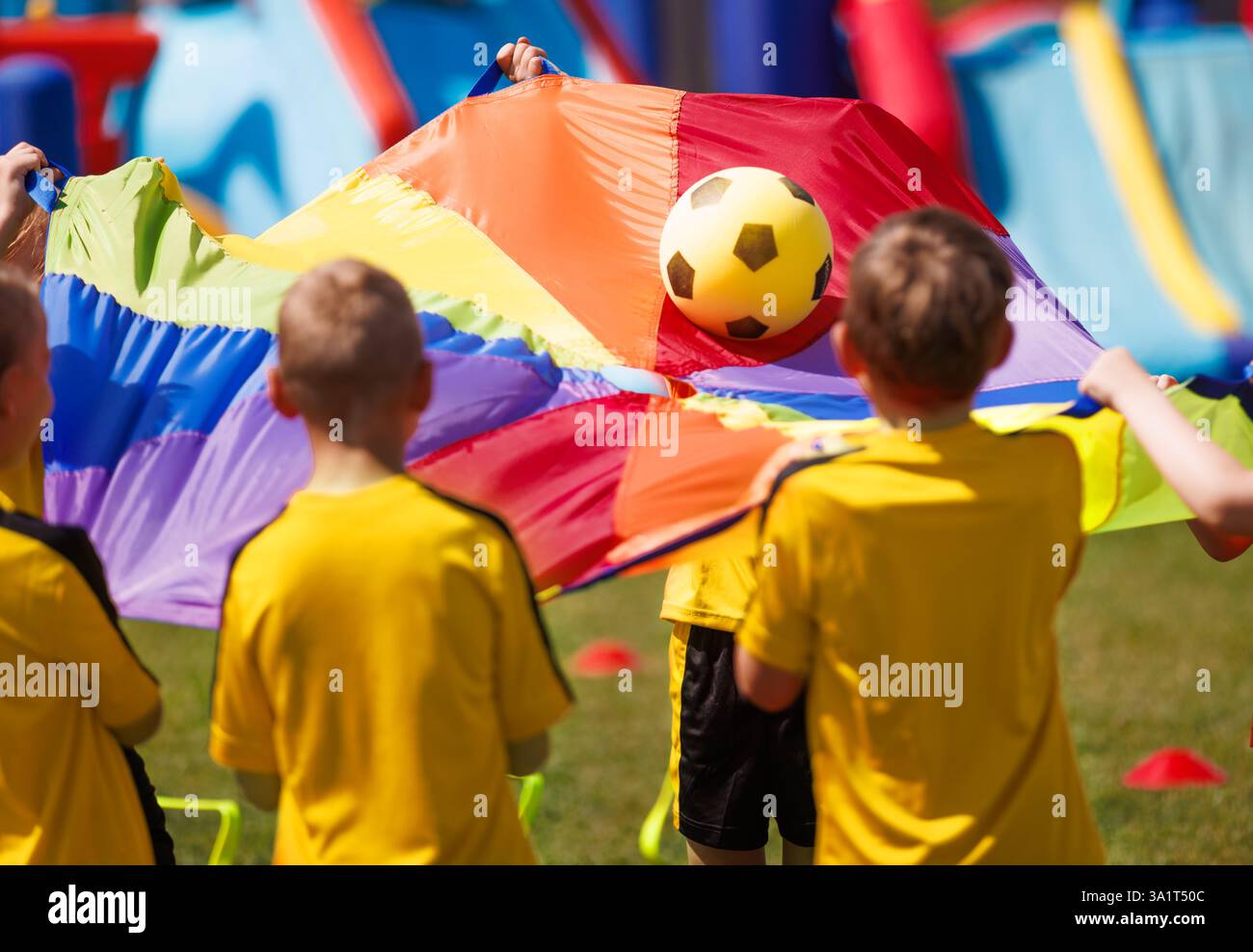 Happy kids playing at soccer football festival. School boys having fun ...