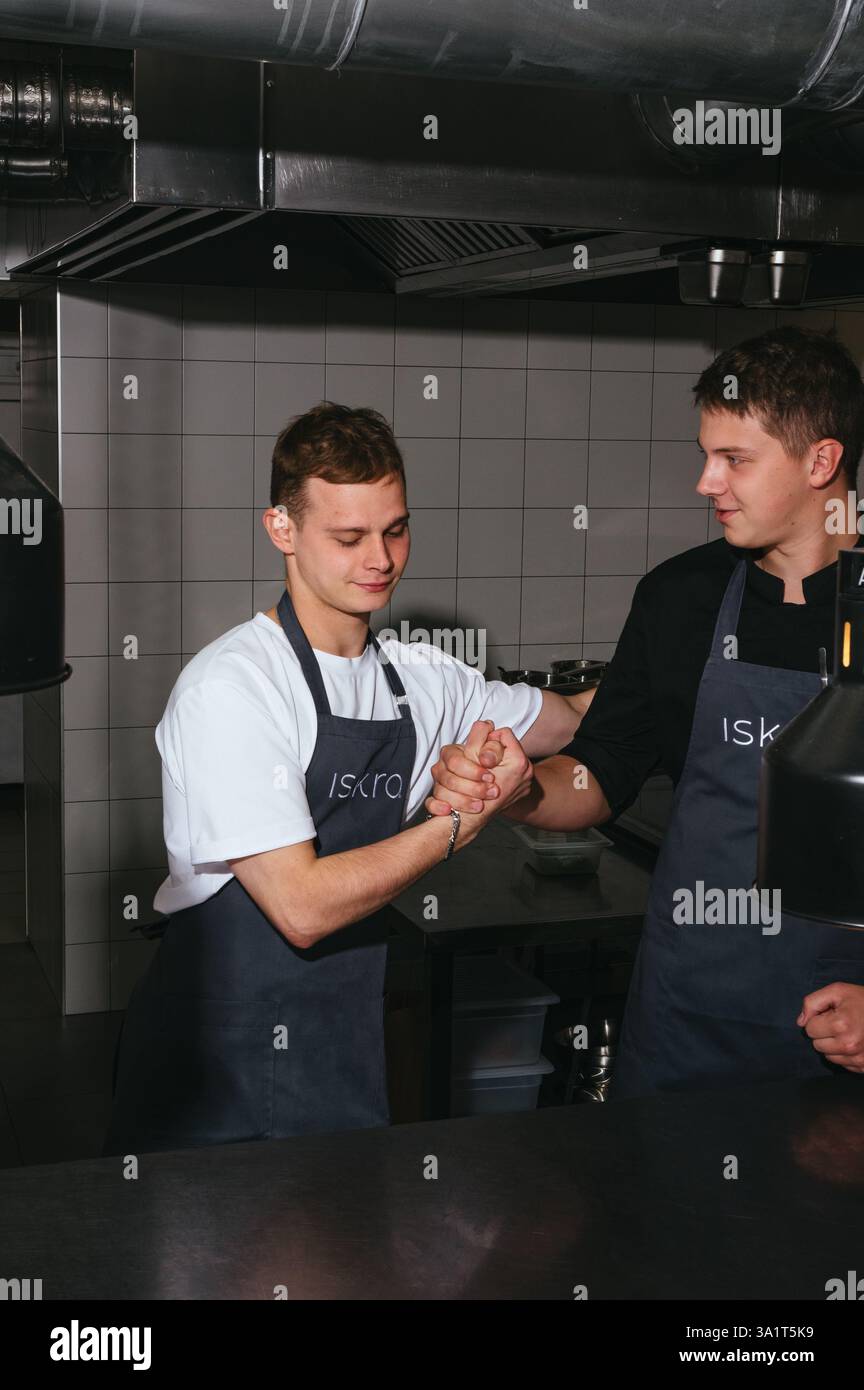 two chefs in the kitchen Stock Photo - Alamy