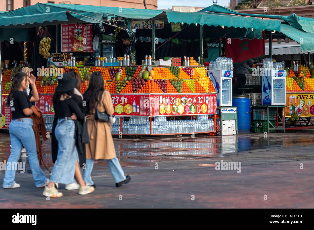 Marrakech, Morocco - February 16, 2025: Tourists walk through a ...