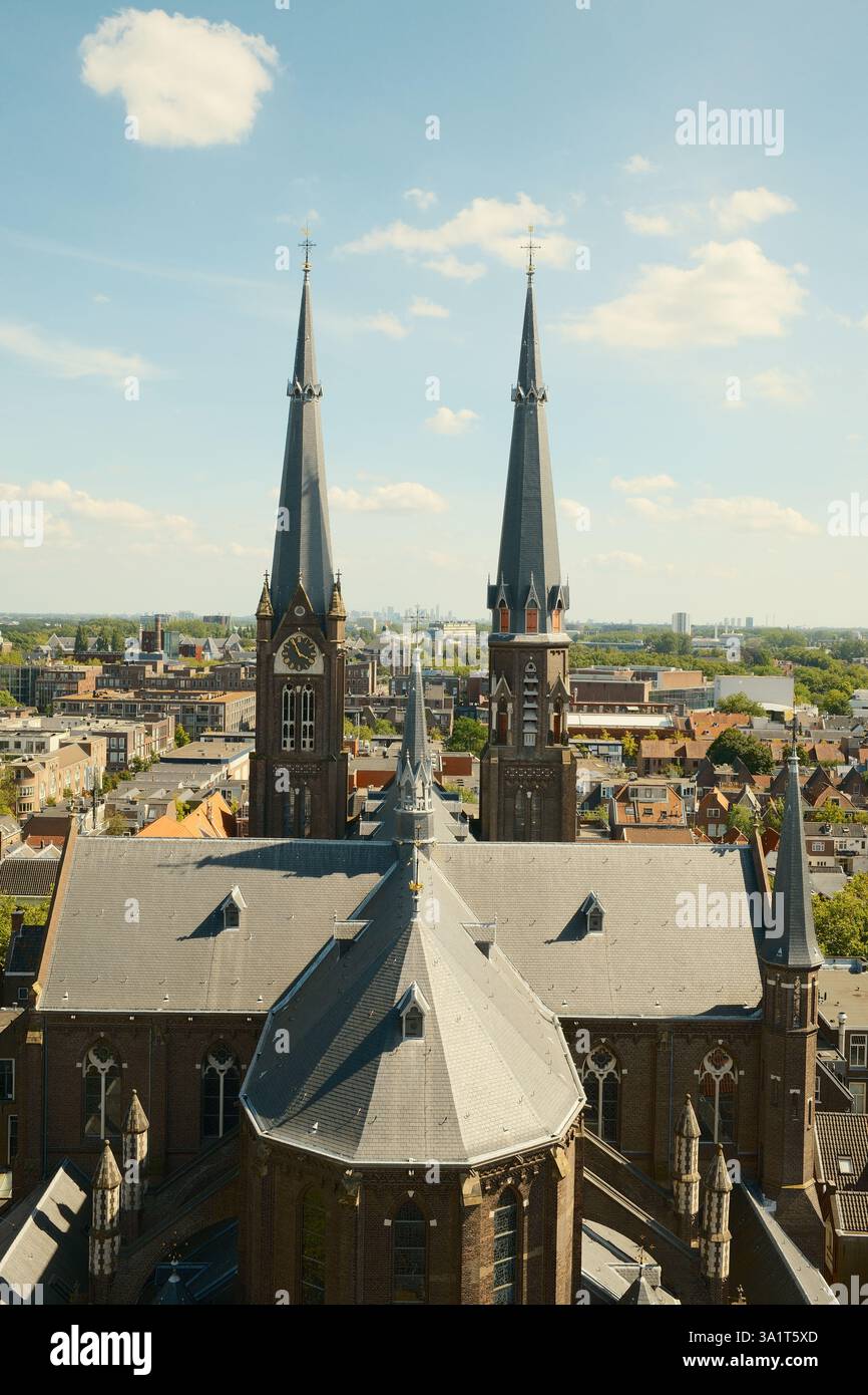 Church steeples rising above dutch cityscape on sunny day Stock Photo ...