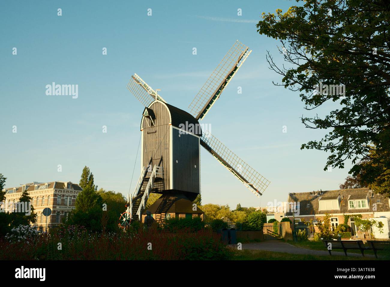 Traditional dutch windmill standing tall in a residential area Stock Photo - Alamy