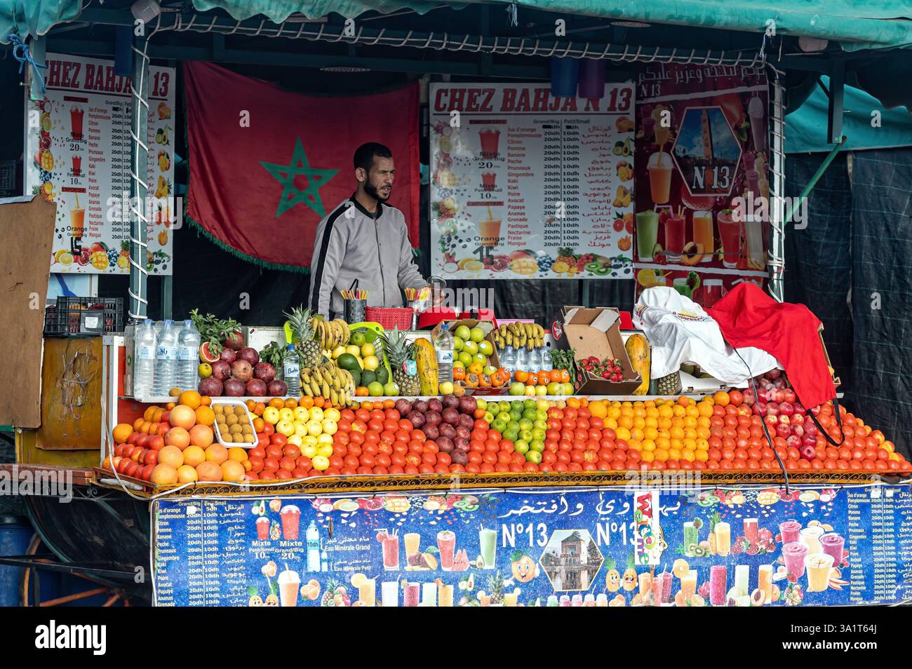 Marrakech, Morocco - February 16, 2025: Fruit vendor stands behind ...