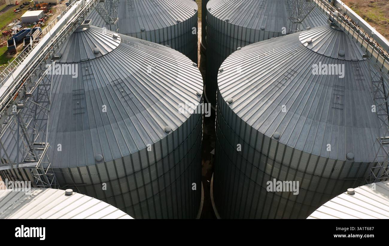 Aerial view of industrial grain silos storing harvested crops at ...