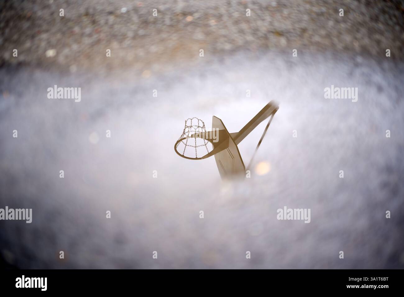 Basketball hoop reflecting in a puddle after the rain Stock Photo - Alamy