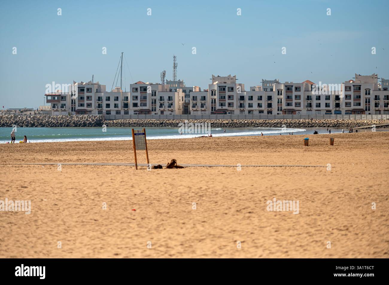 Agadir, Morocco - February 21, 2025: People relax on the sandy beach ...