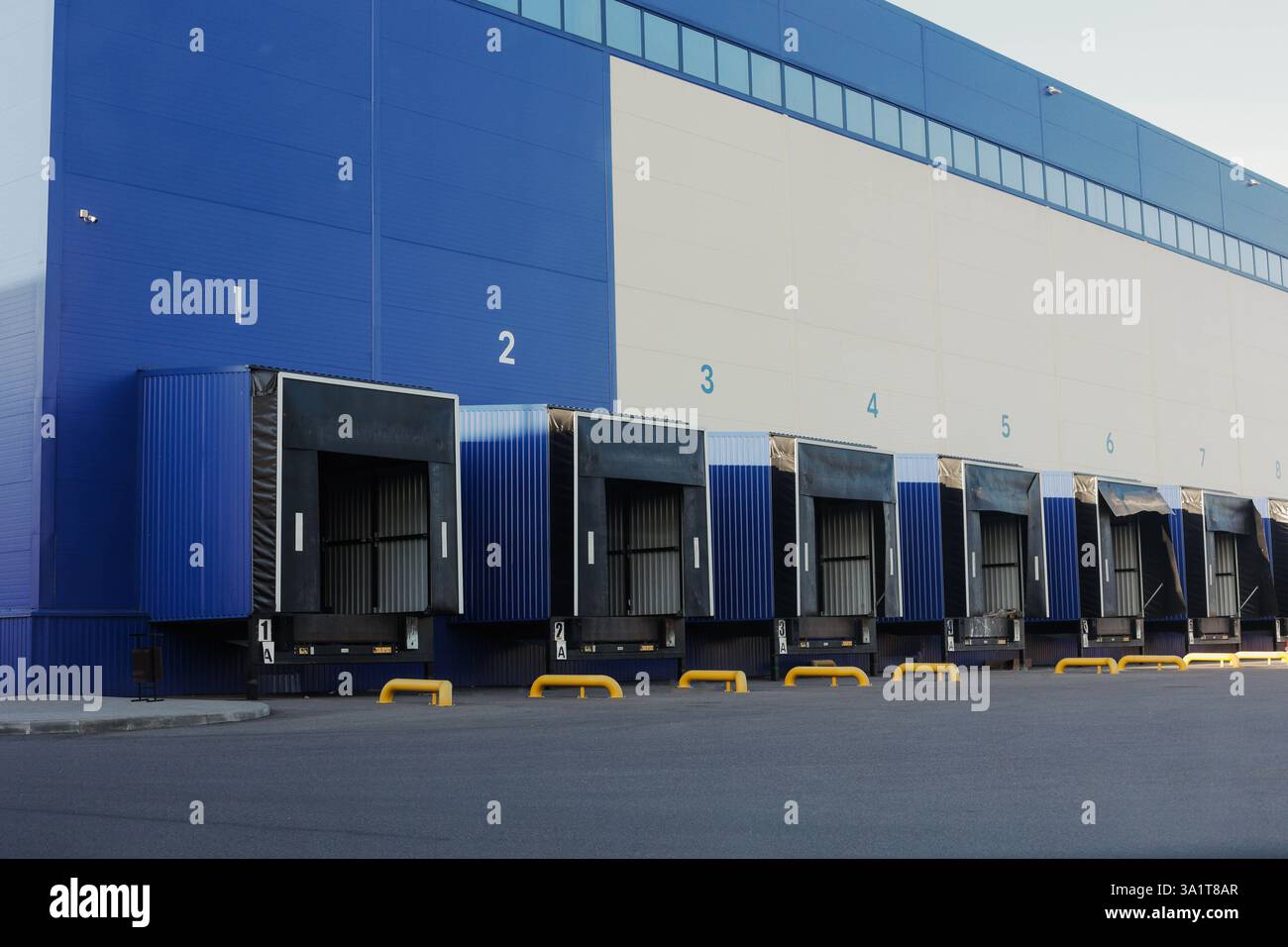 Entrance ramps of the large logistic warehouse with gates for loading ...