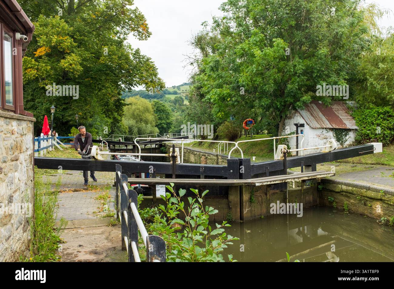Man opening lock gate, Saltford, Somerset, UK Stock Photo - Alamy