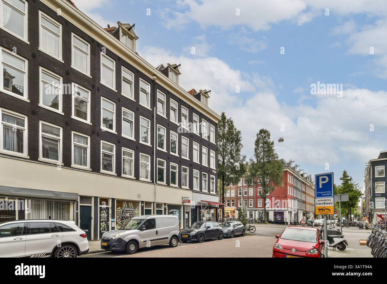 A picturesque street view featuring charming buildings, greenery, and ...