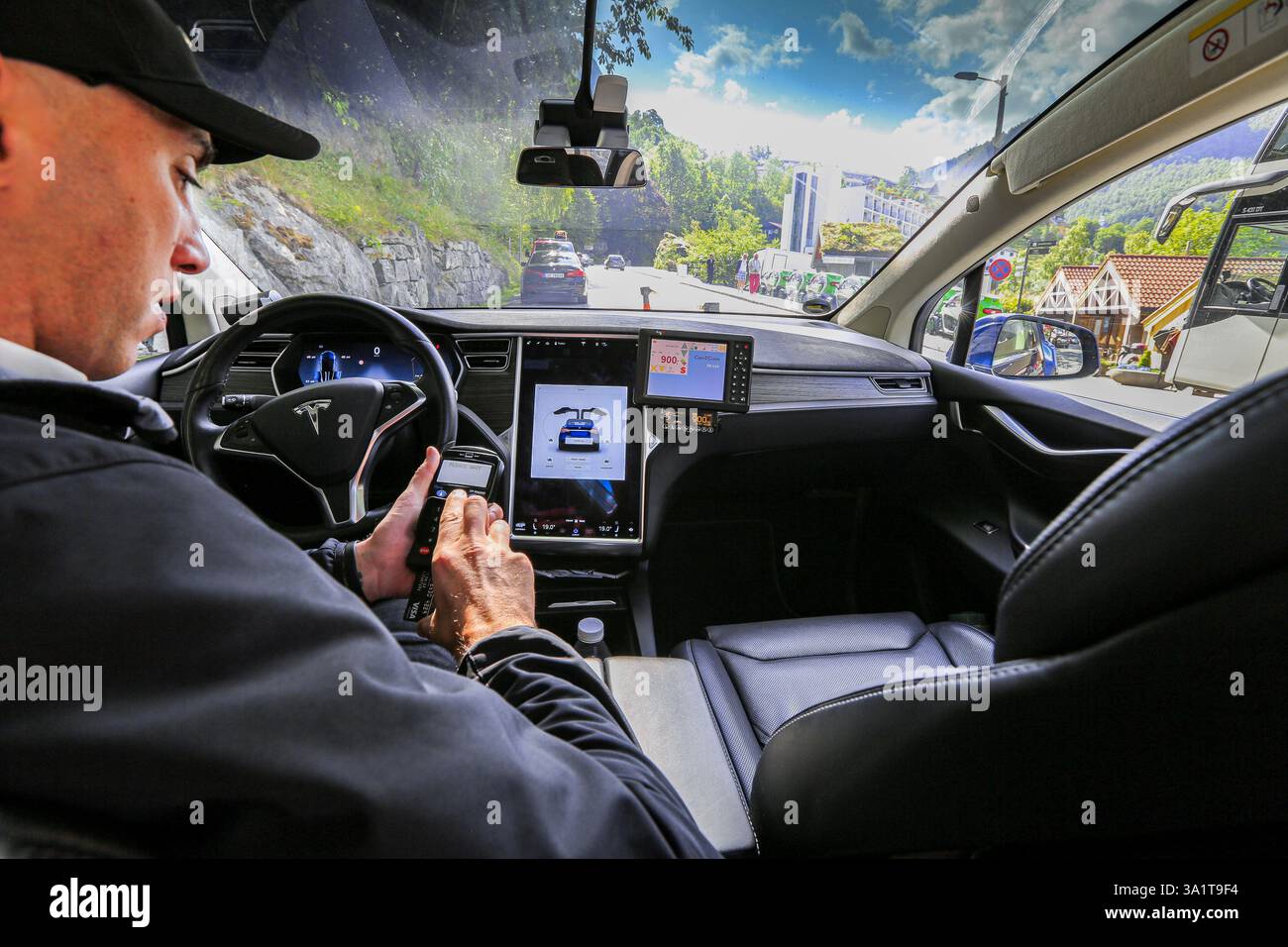 A taxi Tesla Tesla model X with double-hinged falcon wing open doors ...