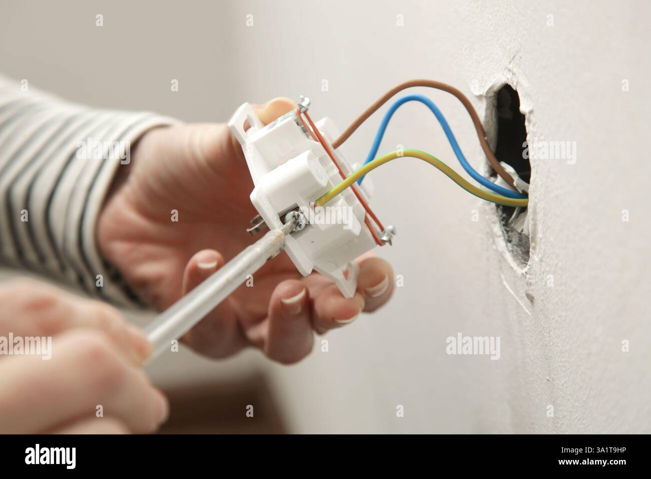 Diy electrician installing mains hi-res stock photography and images ...
