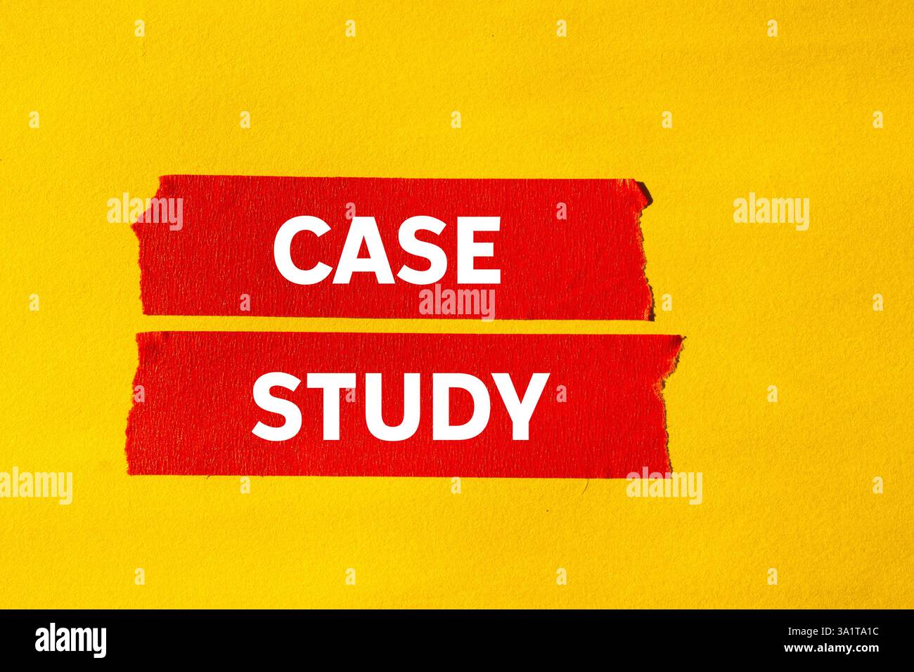 Case study message written on ripped torn red paper tape on yellow background. Conceptual case ...