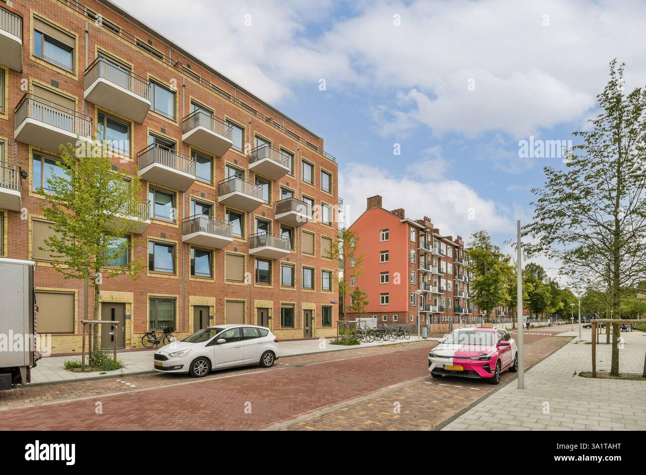 Features a modern residential street with well-designed buildings ...
