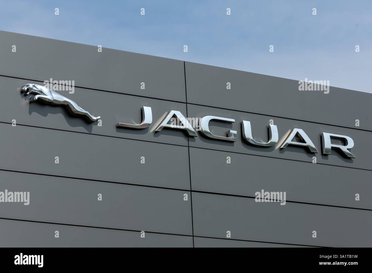 Jaguar chrome logo sign at the Jaguar showroom in Utrecht. Jaguar is ...