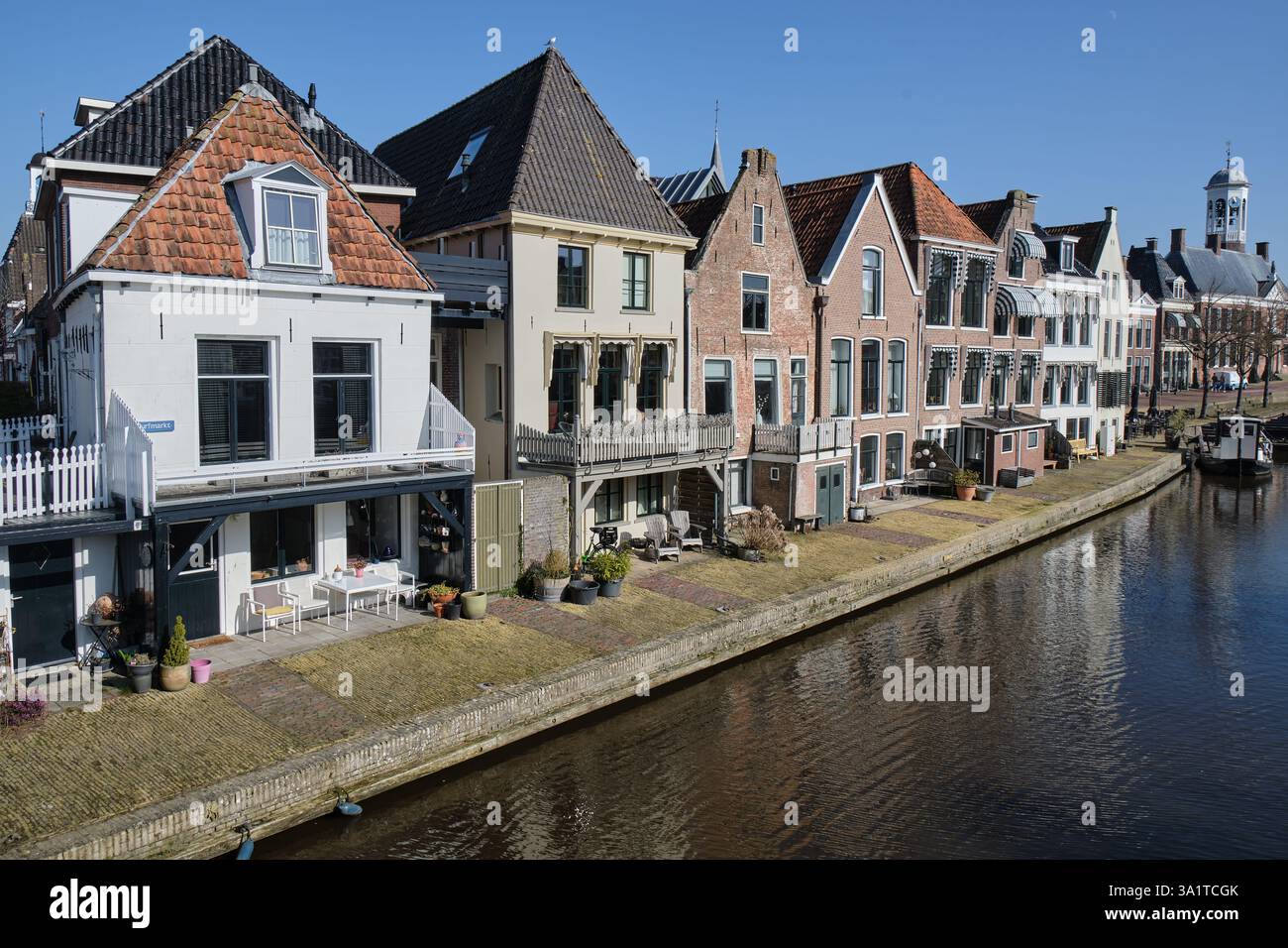 March 6, 2025 - Dokkum-Netherlands: Traditional Dutch canal houses with ...