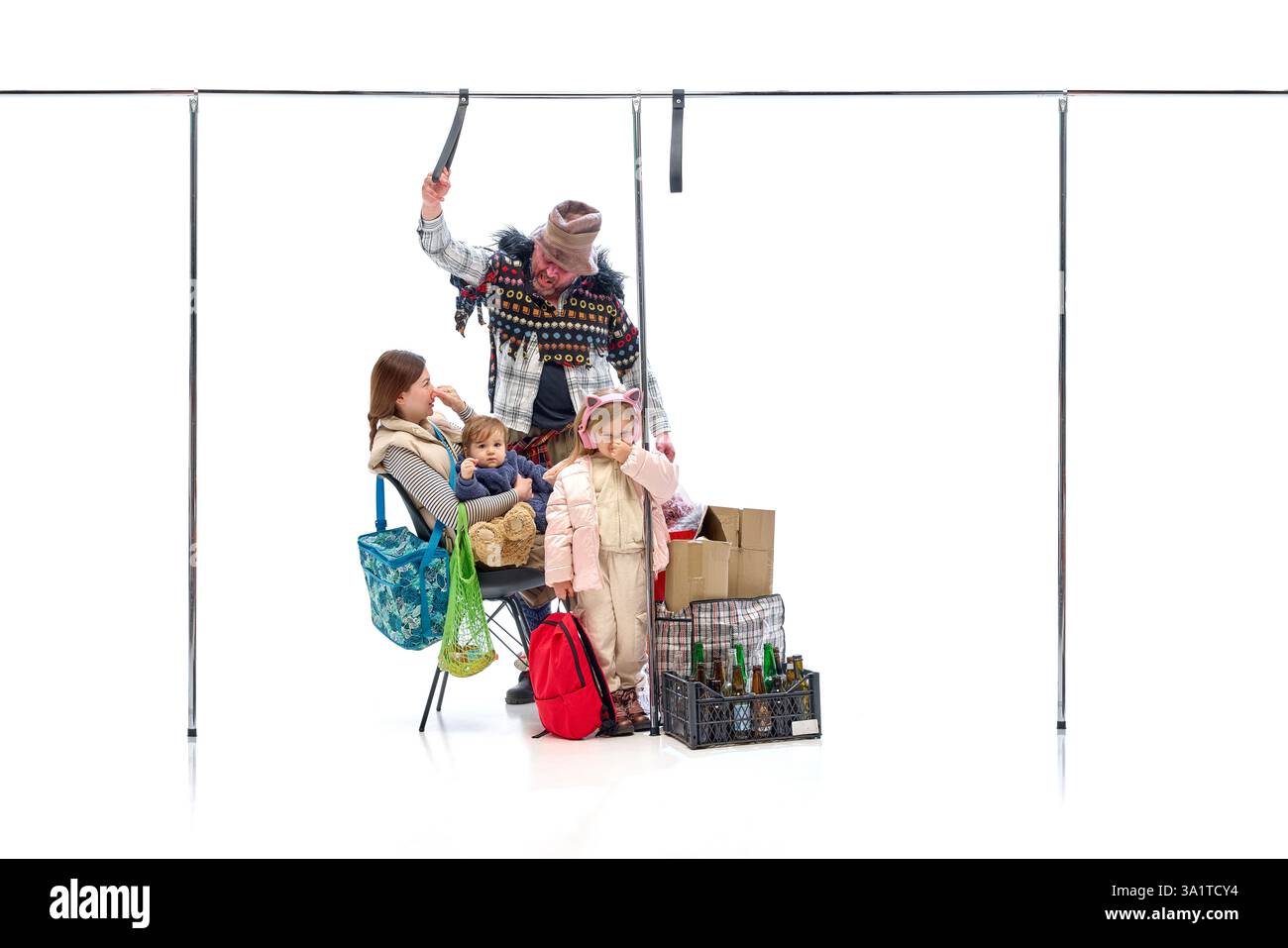 Homeless man towering over seated mother with children, causing ...
