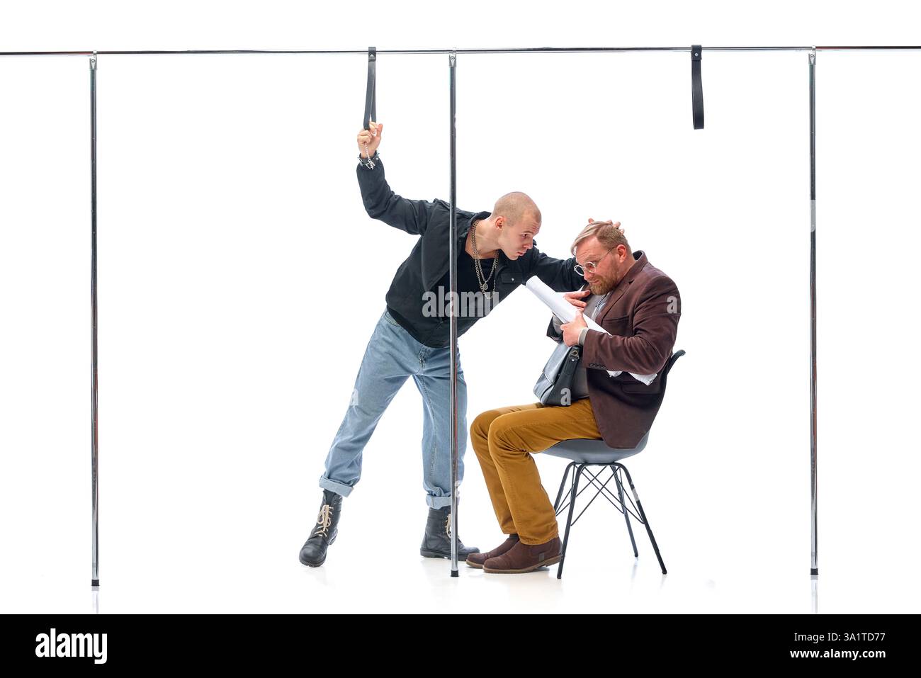 Aggressive young man intimidating businessman with documents in hand ...