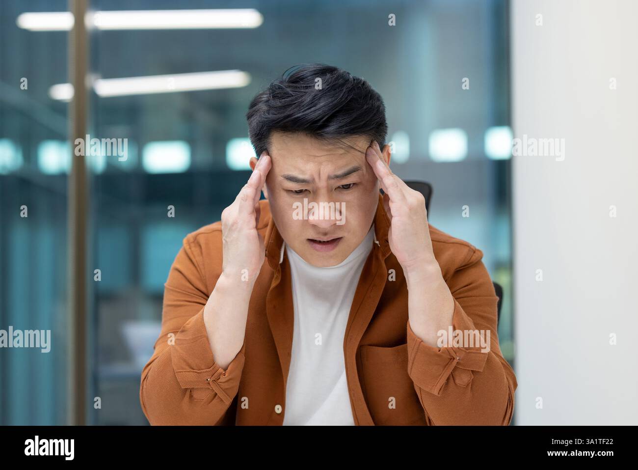 Headache in office worker at workplace. Man suffering from migraine ...