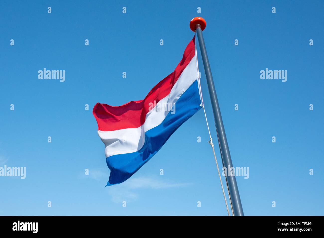 Dutch national flag waving on the steel mast of a ship Stock Photo - Alamy