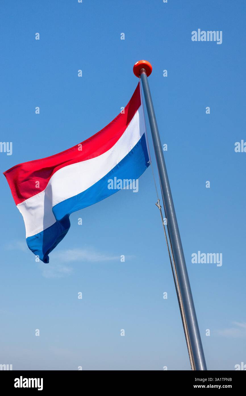 Dutch national flag waving on the steel mast of a ship Stock Photo - Alamy