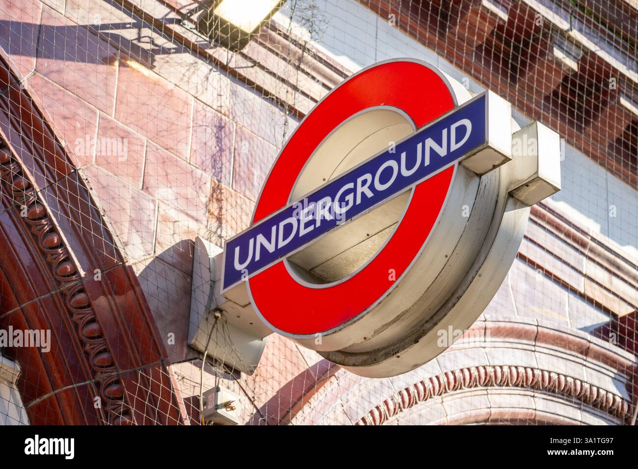 The iconic red and blue sign marks an entrance to the London ...
