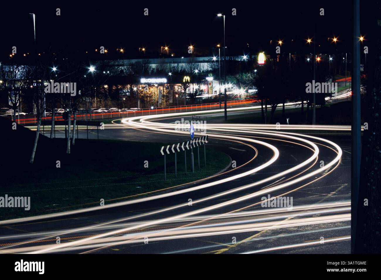 Night time long exposure photography with trailing car lights and trick ...